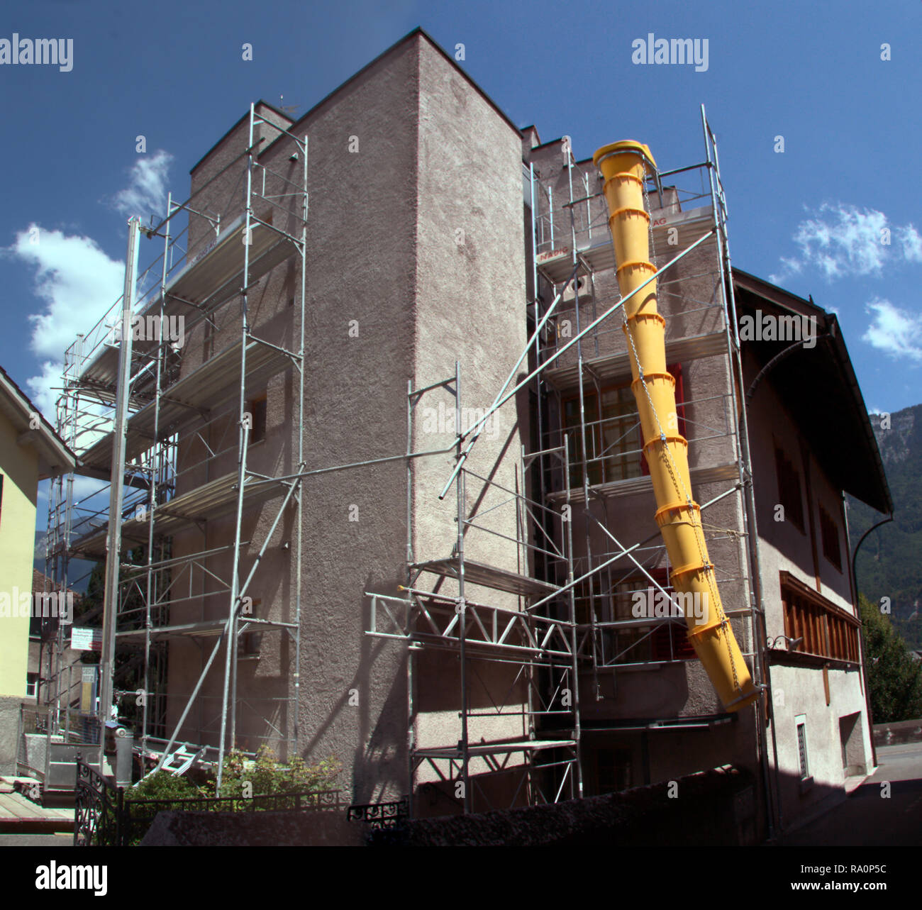 Renovation in Flums, Switzerland, showing extensible waste-disposal ...