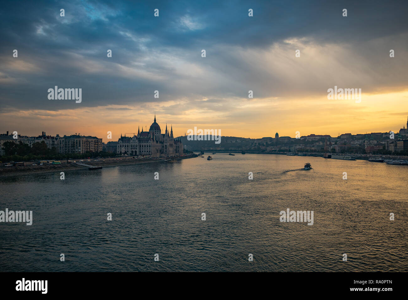 Parliament and famous bridges of budapest at sunset hi-res stock ...