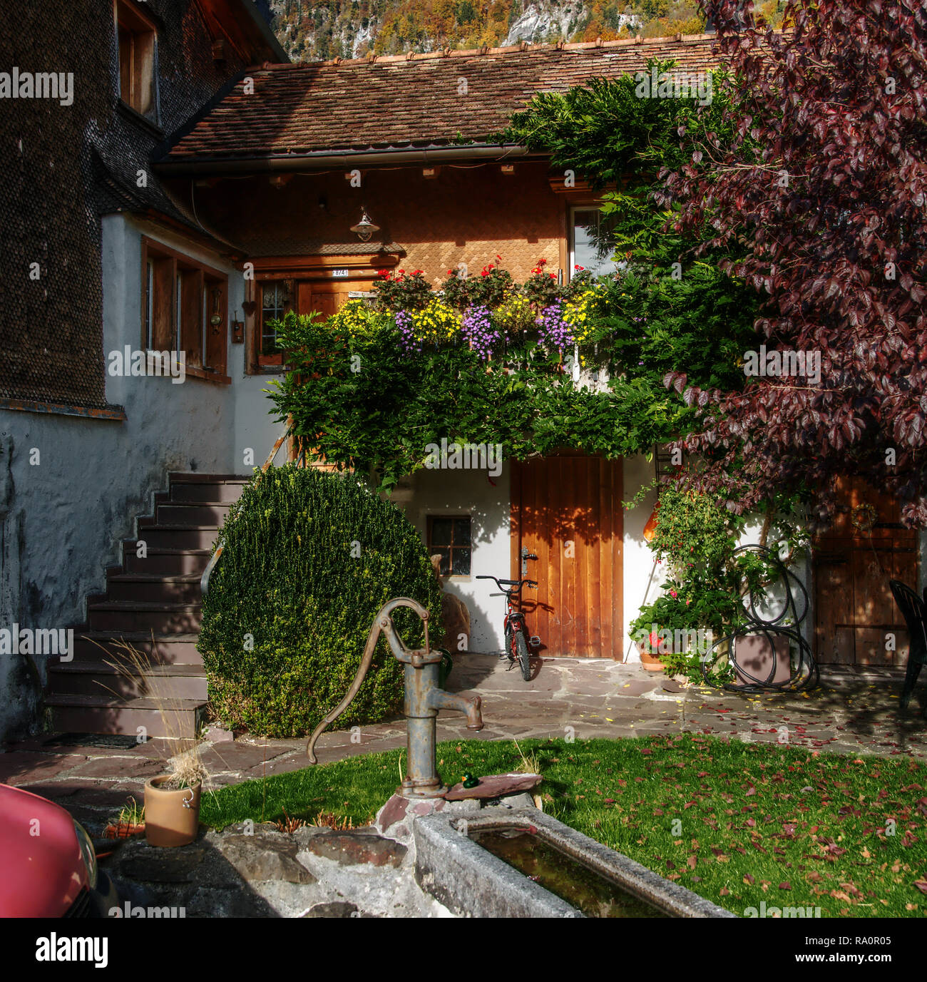 Farmhouse in Swiss alpine village of Berschis Stock Photo - Alamy