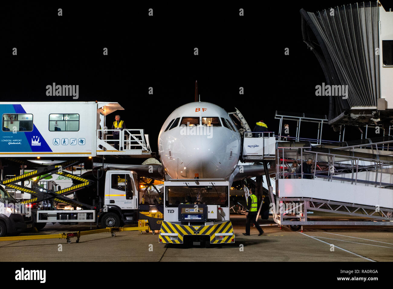An Easyjet aeroplane on the runway at night Stock Photo - Alamy