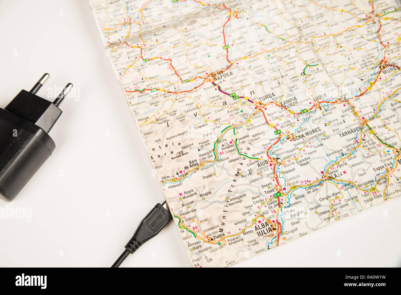 Paper map with a USB cable, a analog vs. digital concept Stock Photo ...