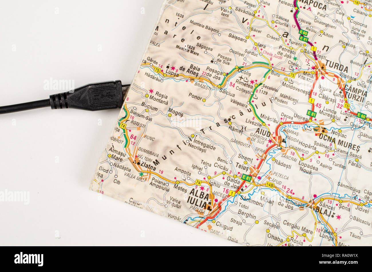 Paper map with a USB cable, a analog vs. digital concept Stock Photo ...