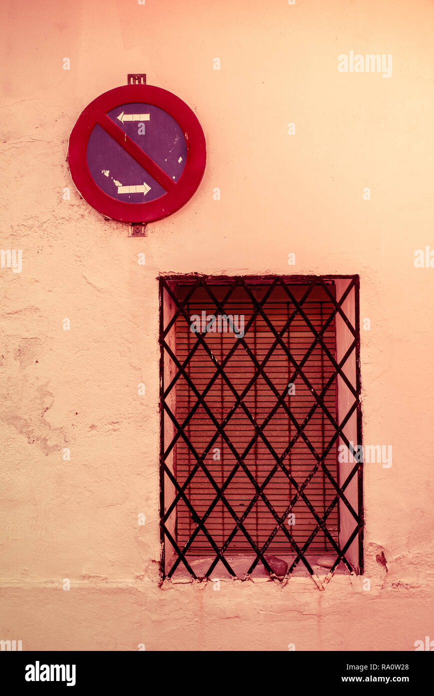 Old window with shutters and weathered traffic sign Stock Photo - Alamy