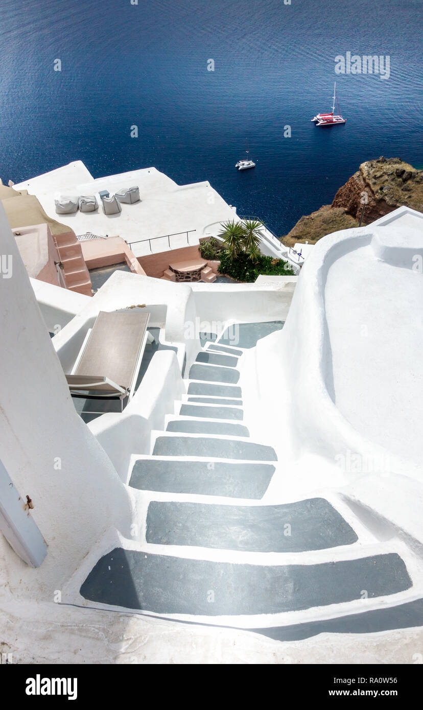 Traditional architectural steps with boat on sea Santorini Greece Stock ...