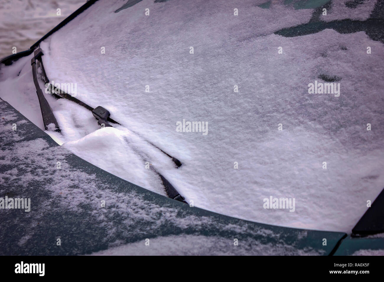 Frozen car windshield covered with ice and snow Stock Photo - Alamy