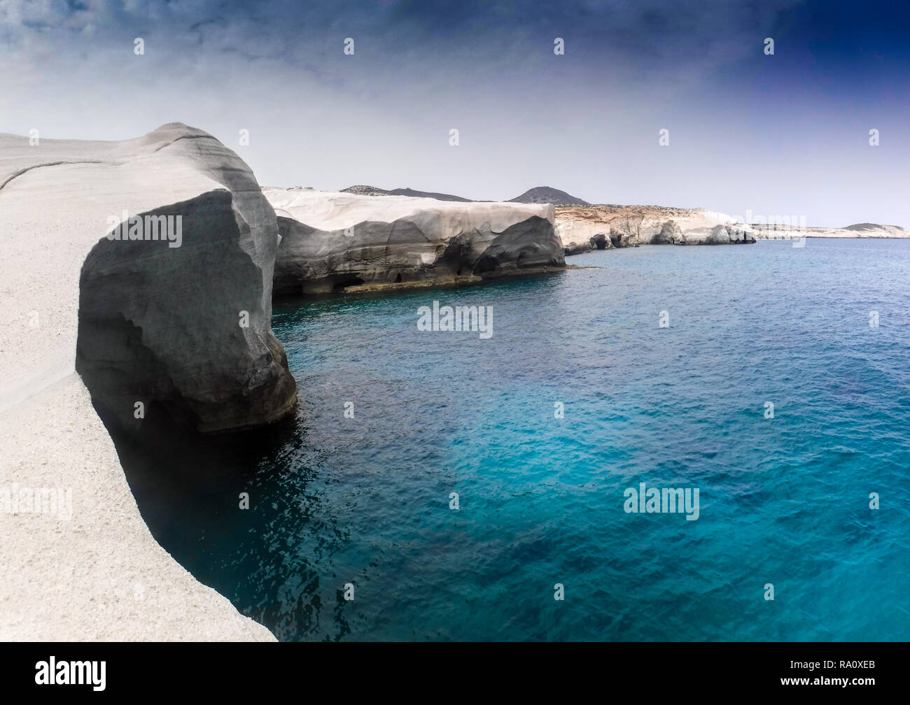 White rock cliff and sea Milos Island Greece Stock Photo - Alamy