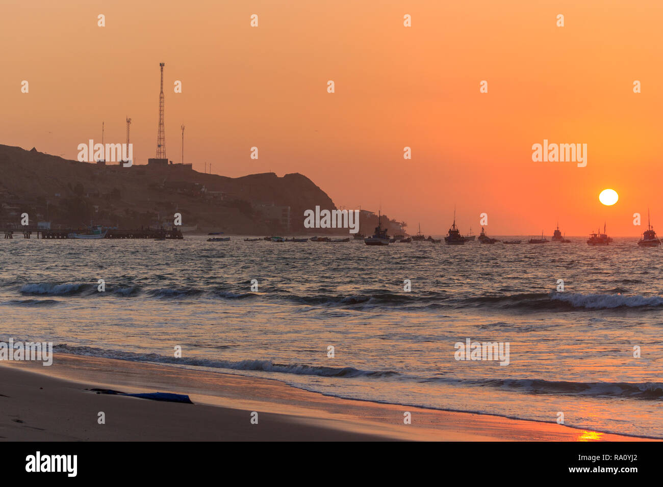 sunset over mancora beach with fisher boats, peru Stock Photo - Alamy