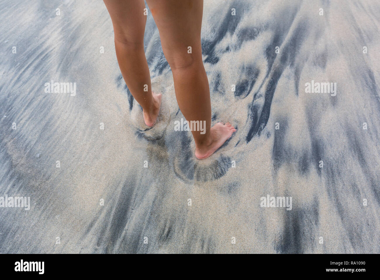 Legs and sand pattern, which creates the ocean from sand of different ...