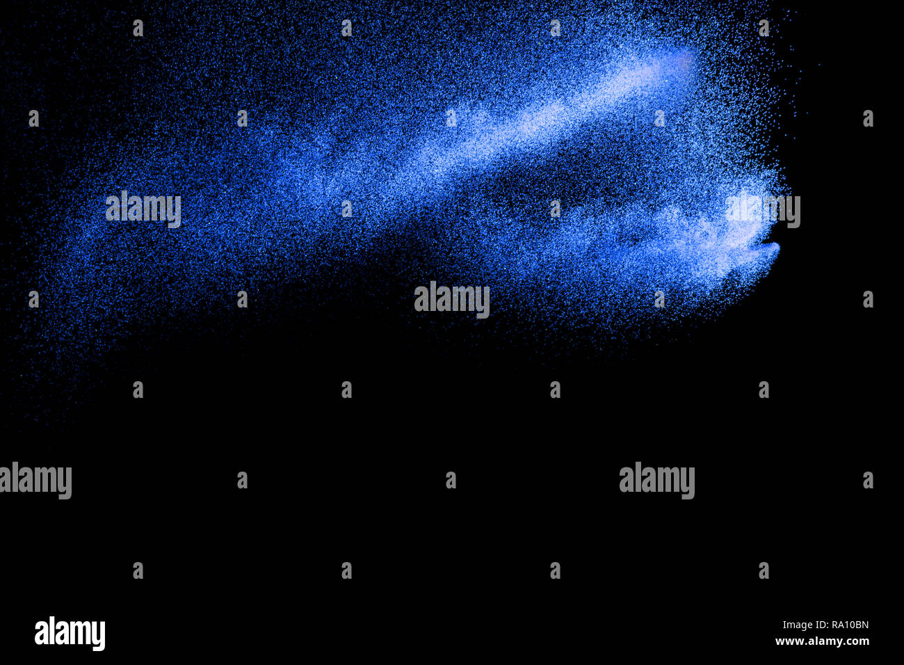 Abstract blue dust explosion on black background. Abstract blue powder ...