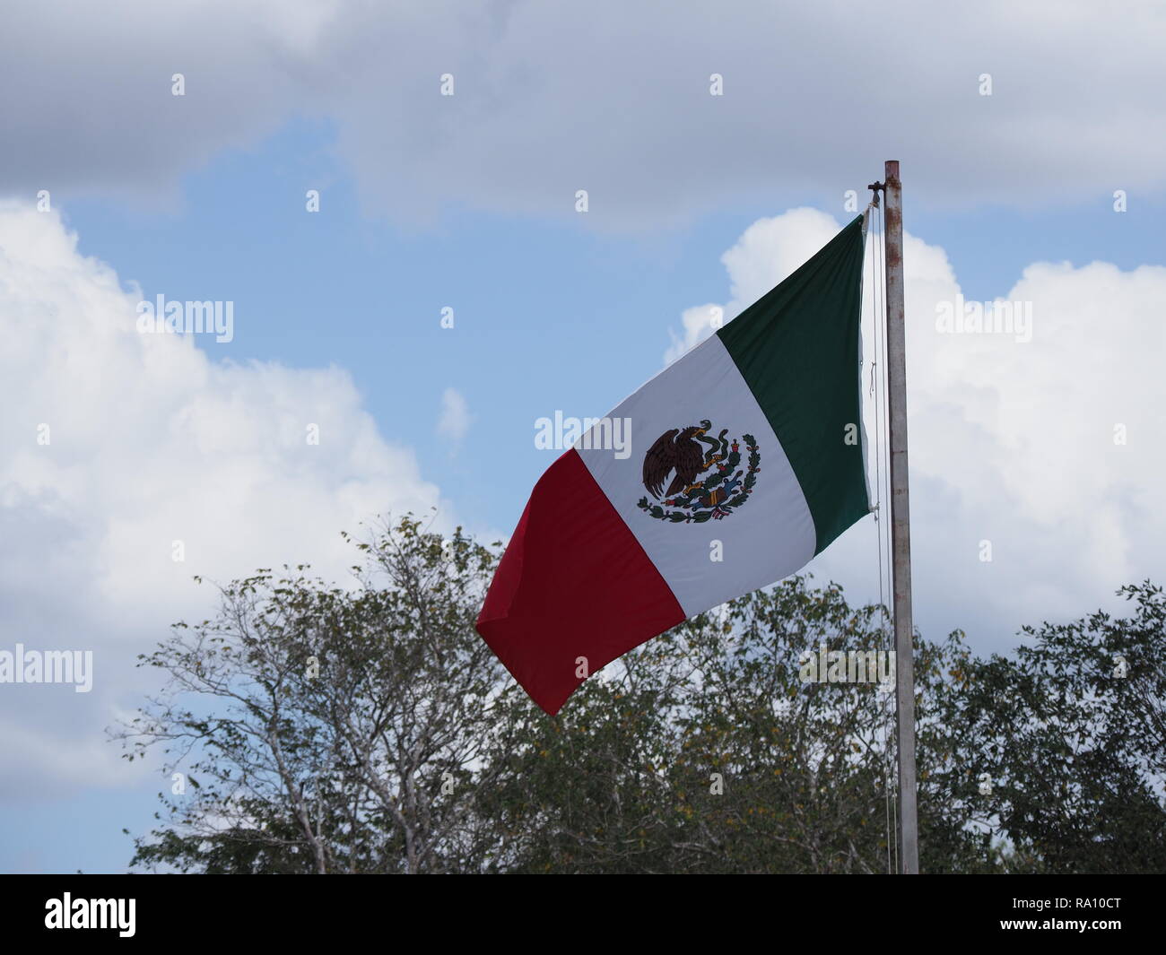 National maxican flag at Chichen Itza city near famous archaeological ...