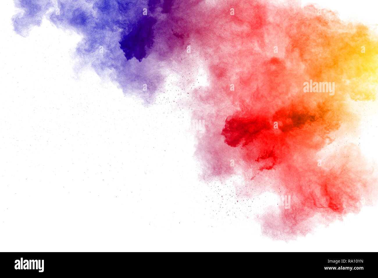 Abstract multi color powder explosion on white background. Freeze ...