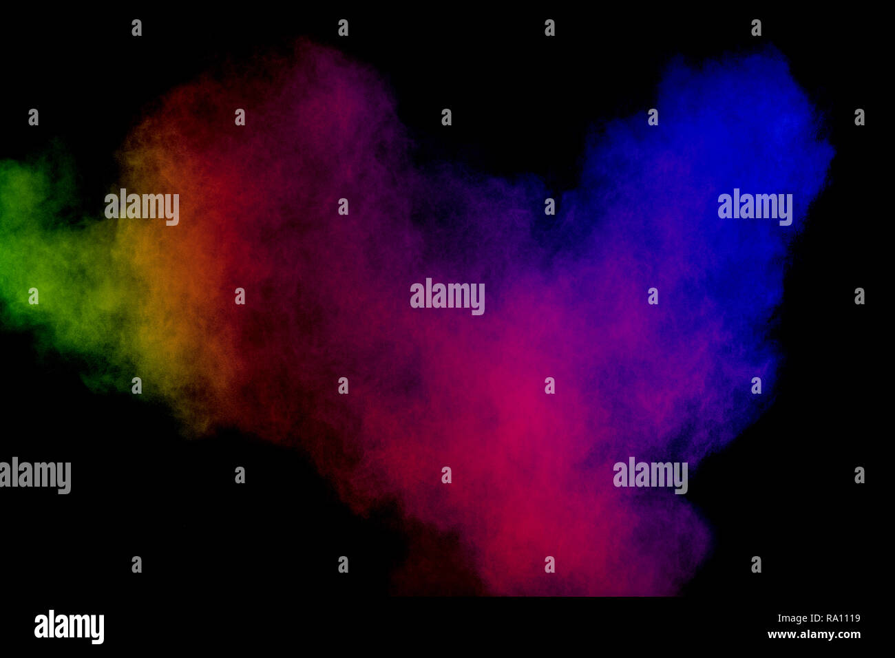 Abstract multi color powder explosion on black background. Freeze ...