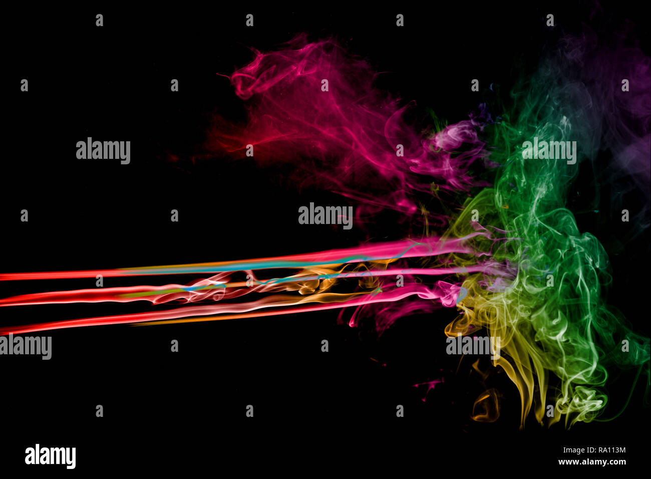 Abstract multi colored smoke flowed on black background Stock Photo - Alamy