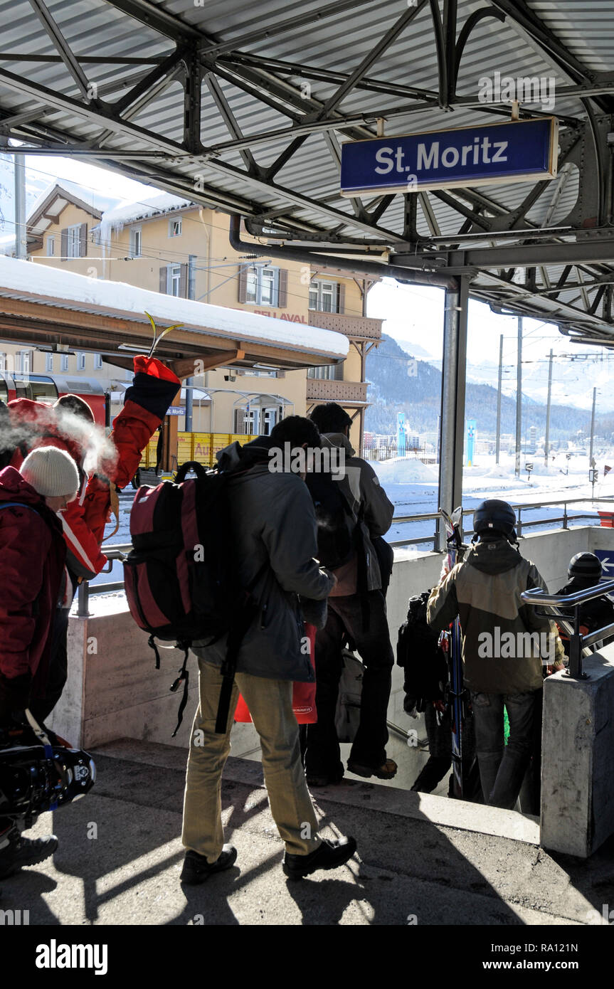 Passngers and skiers arriving at St. Moritz rail station in Switzerland ...