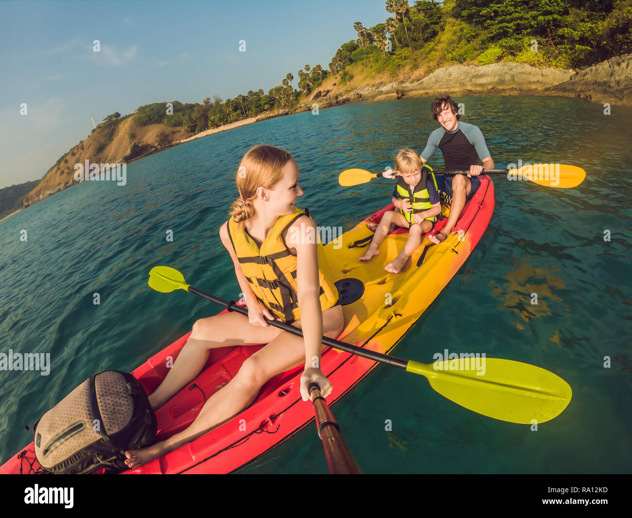 happy family with kid kayaking at tropical ocean Stock Photo - Alamy
