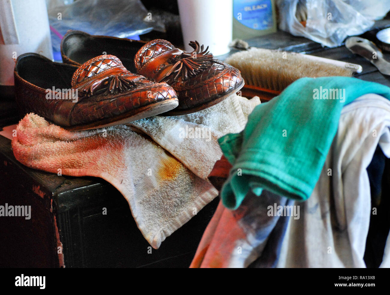 Shoes wait on the bench to be shined at The Shine King in Meridian ...