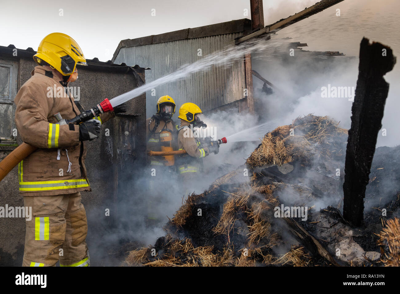 Fire crew attending a barn fire, Cumbria, UK Stock Photo - Alamy