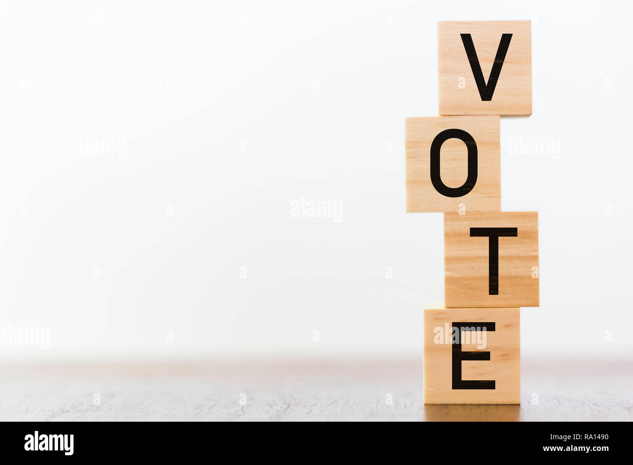 Vote written on wooden cubes Stock Photo - Alamy
