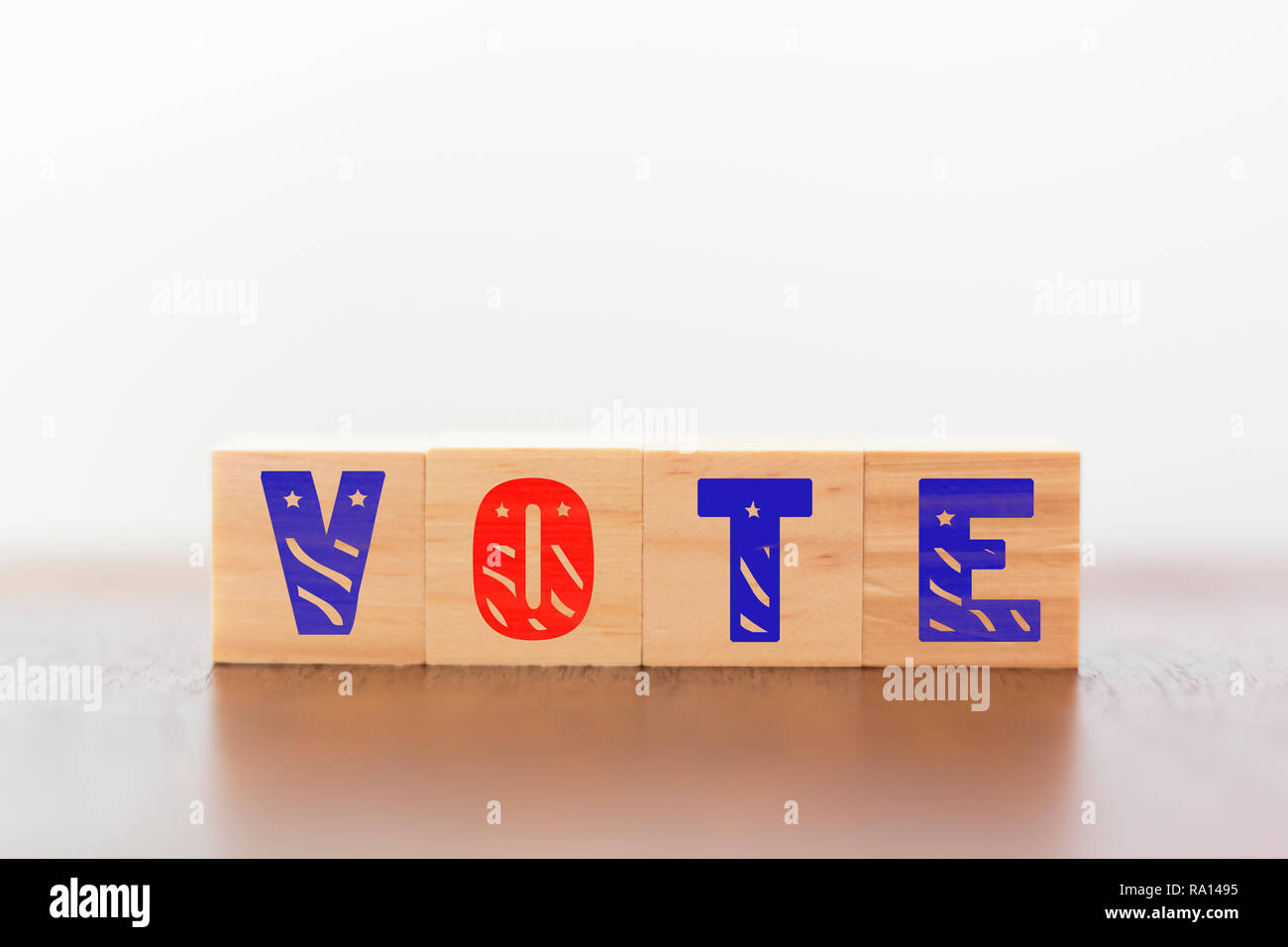 Wooden cubes with vote written against white background Stock Photo - Alamy