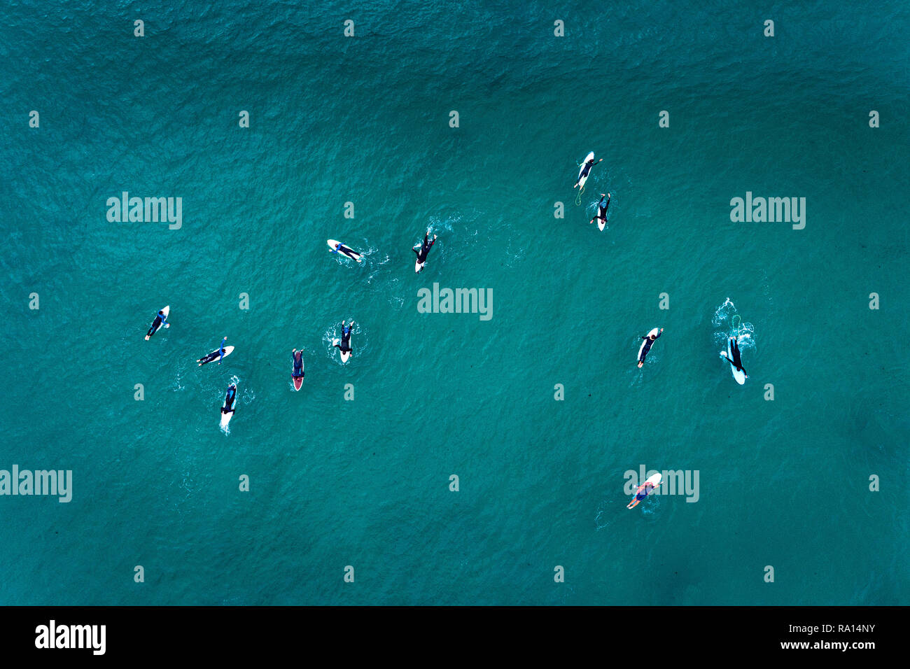 Aerial view of surfers in the ocean at the Baleal beach in Peniche ...