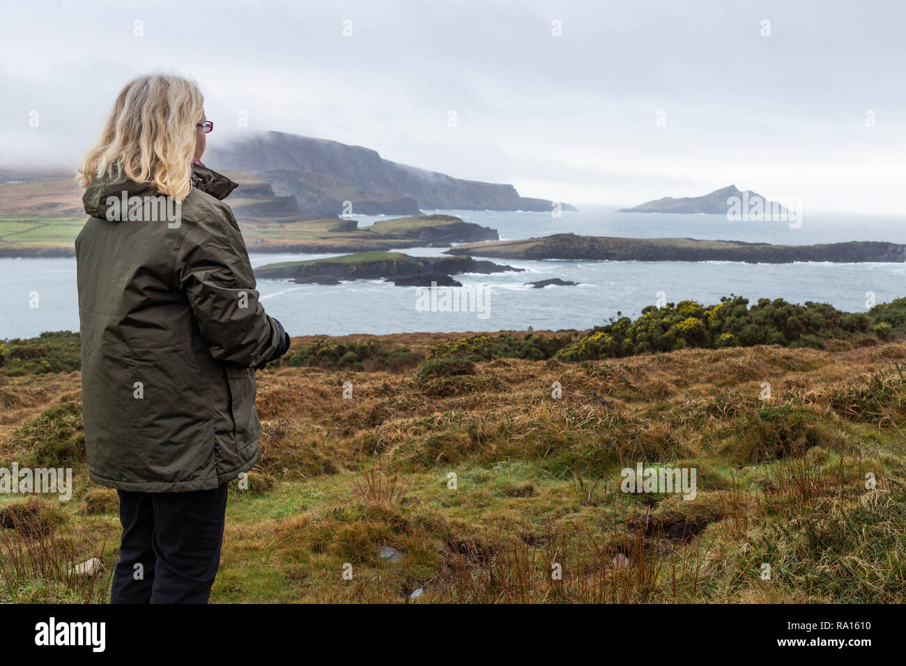 Woman alone walking in the countryside, Valentia Island, County Kerry ...