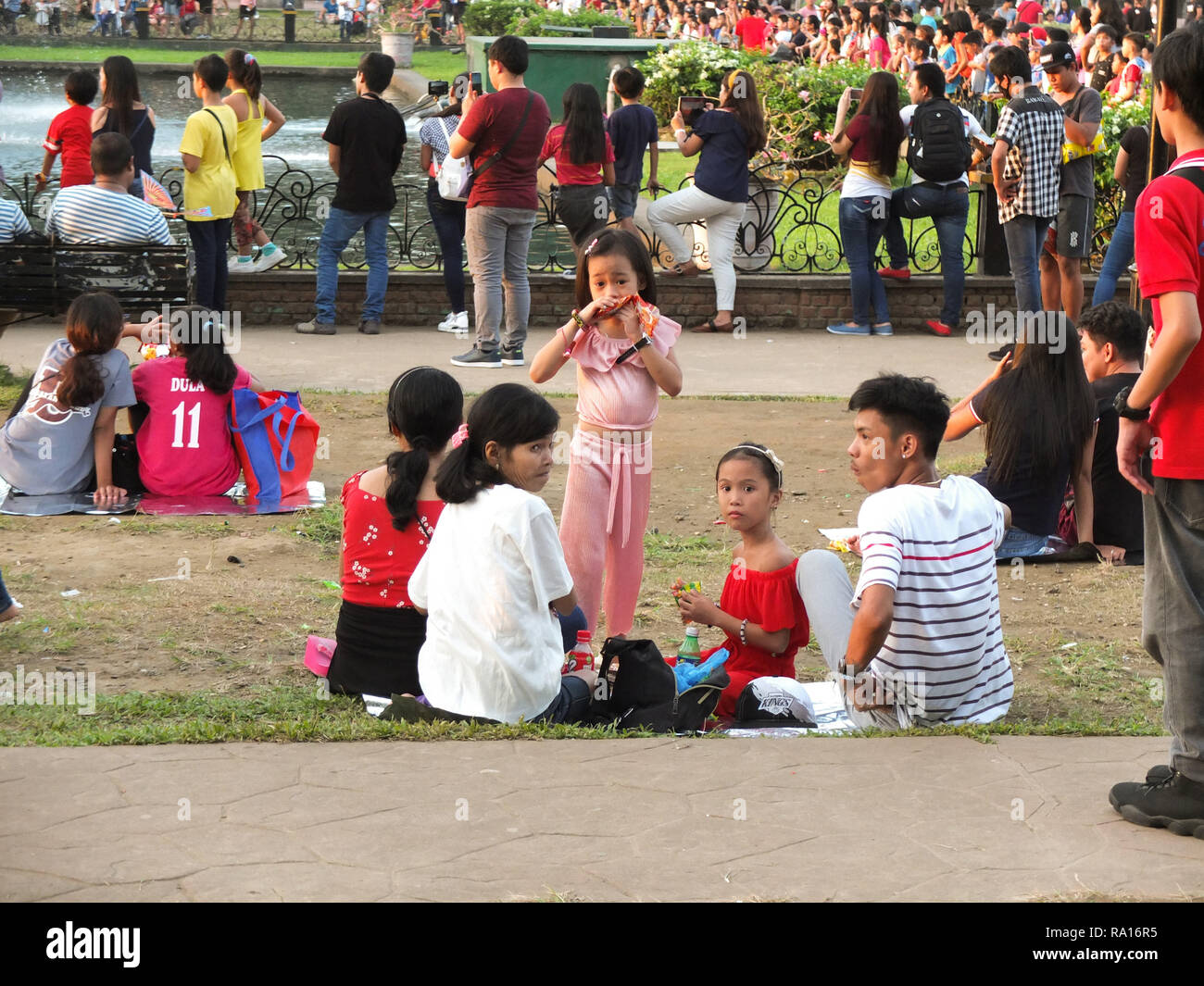 Manila, Philippines. 18th Mar, 2012. Filipino families seen having a ...
