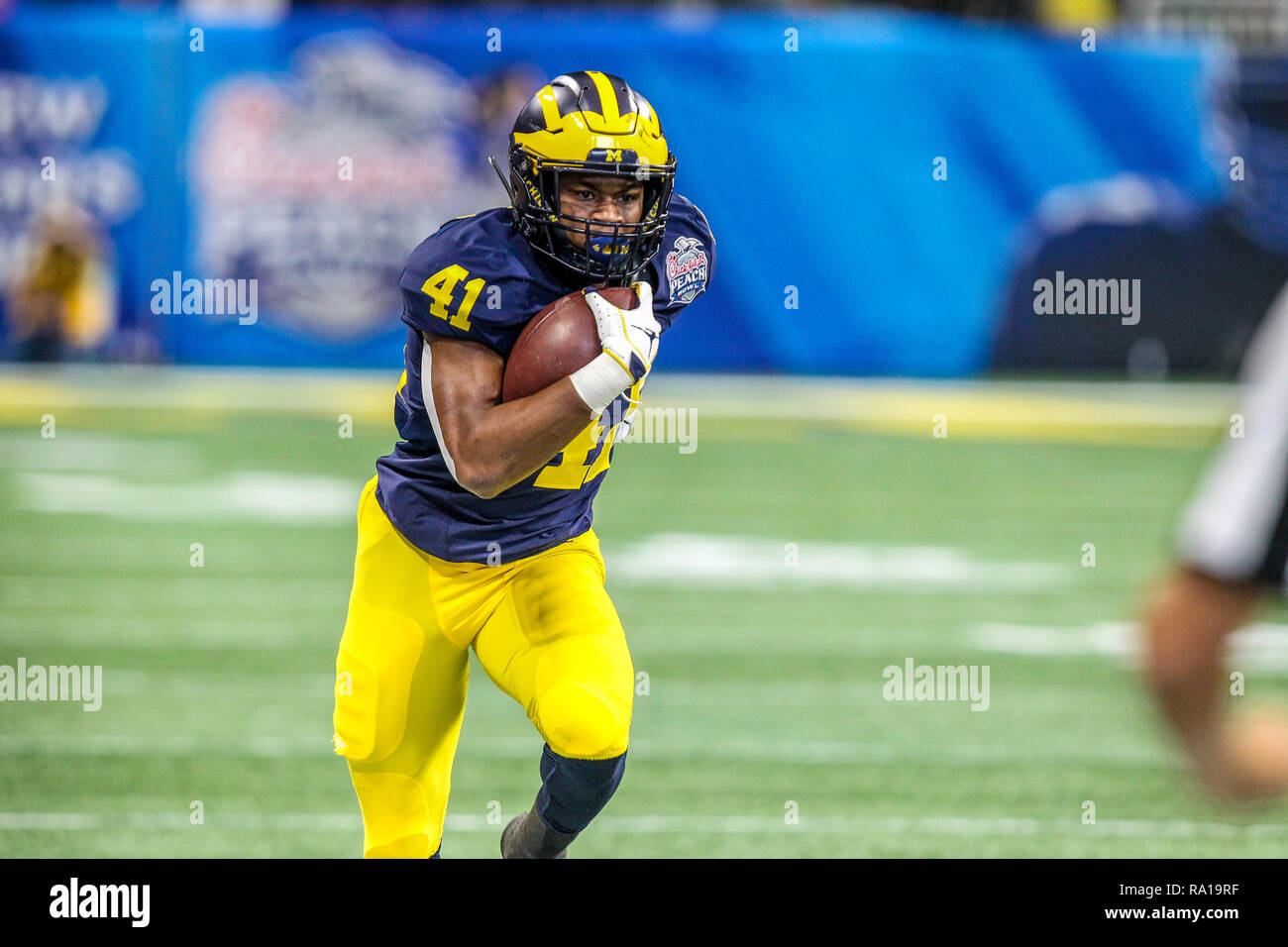 December 29, 2018: Michigan's Christian Turner (41) races by Florida's ...
