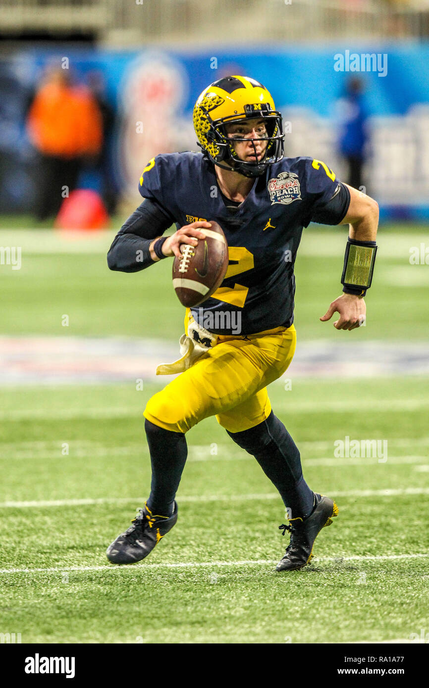 December 29, 2018: Michigan's Shea Patterson (2) rolls out during the ...