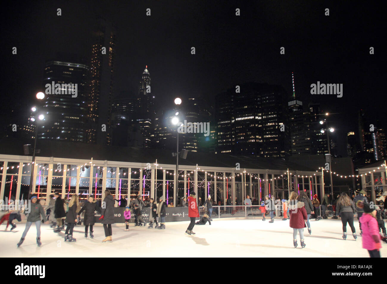 New York, USA. 27th Dec, 2018. Visitors run on the ice rink with a ...