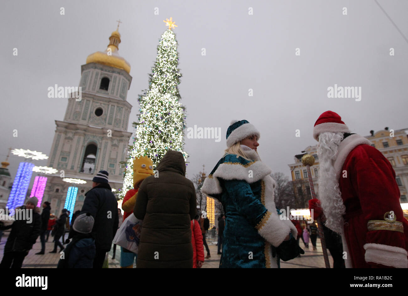 A man dressed as Santa next to the main Christmas tree of Ukraine, on ...