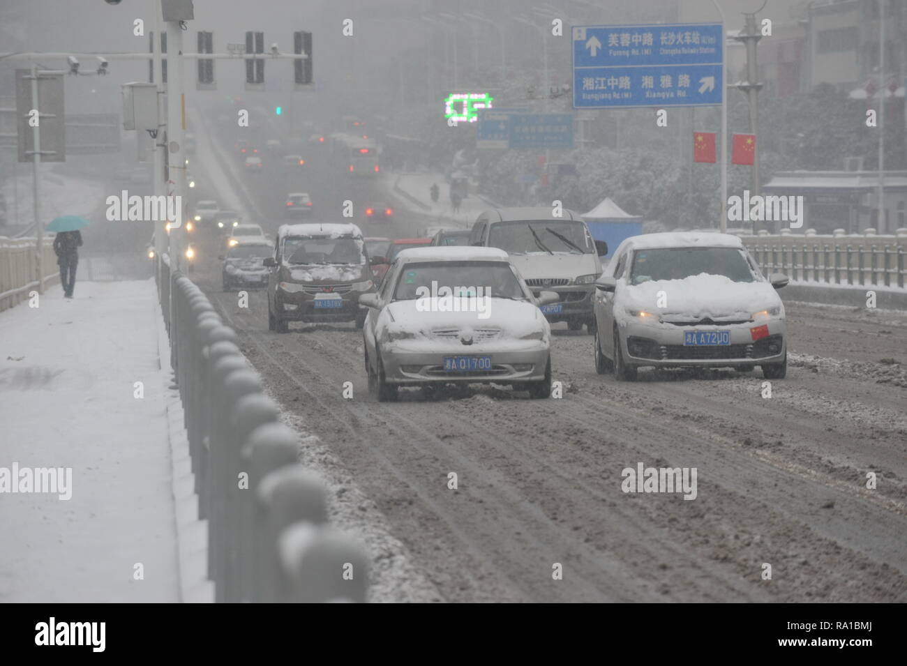 Changsha, Hunan Province, China. 30th Dec, 2018. Cars run on the snow ...