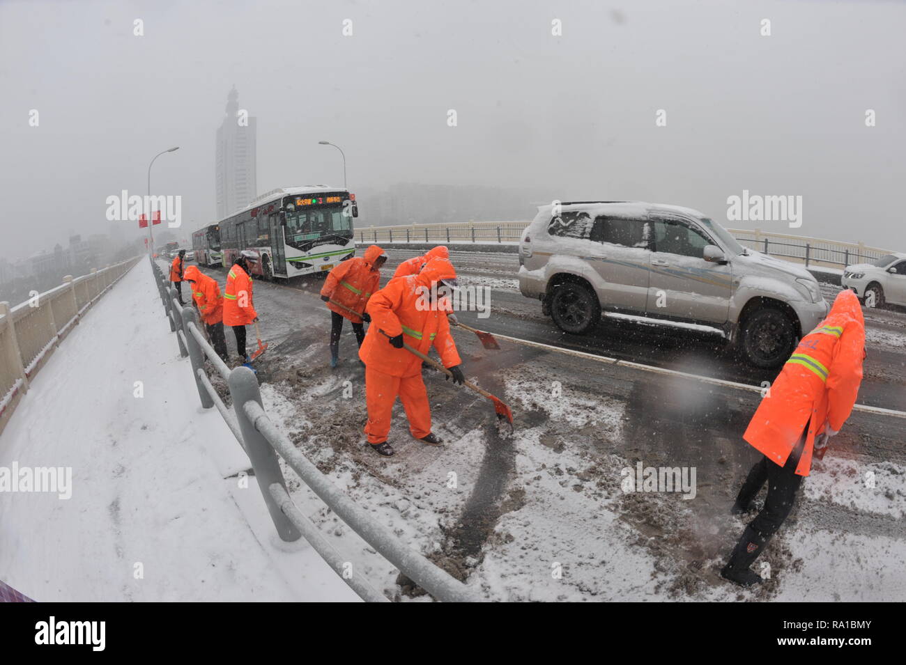 Changsha, Hunan Province, China. 30th Dec, 2018. Sanitation workers ...