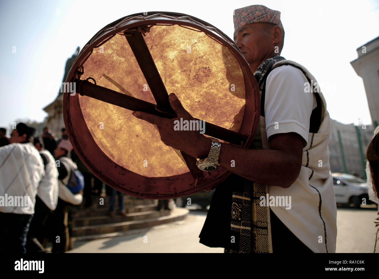 Nepalese man from ethnic Gurung community in traditional attire play ...