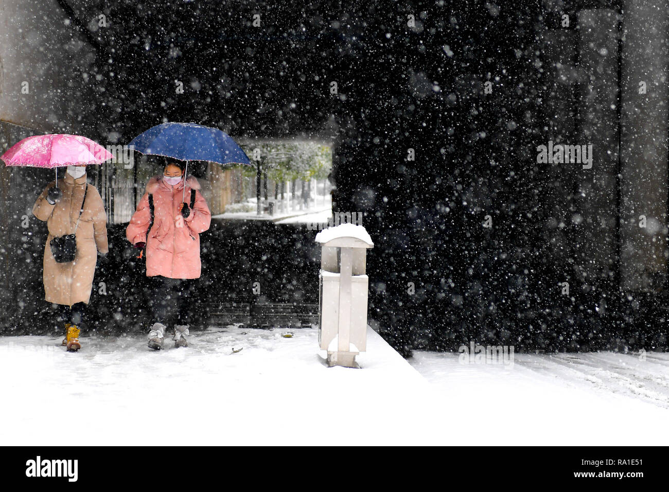 Changsha, China's Hunan Province. 30th Dec, 2018. Pedestrians walk in ...