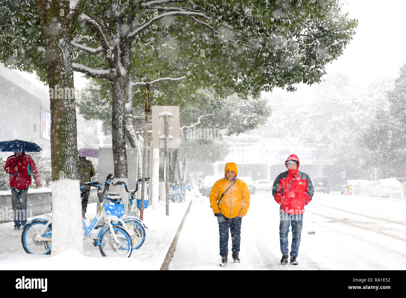 Changsha, China's Hunan Province. 30th Dec, 2018. Pedestrians walk in ...