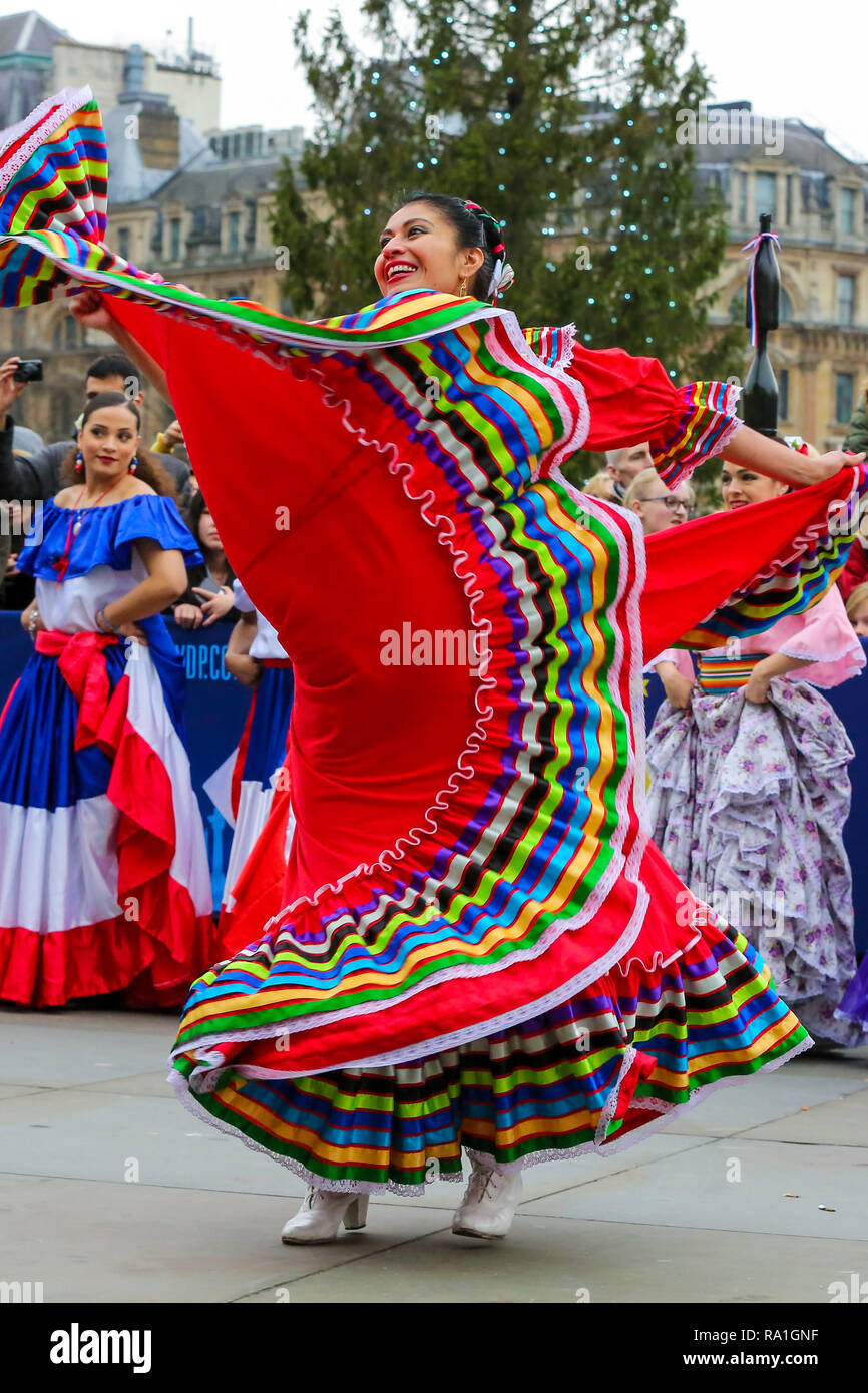 London, UK. 30th Dec, 2018. A dancer from Carnaval Del Pueblo are seen ...
