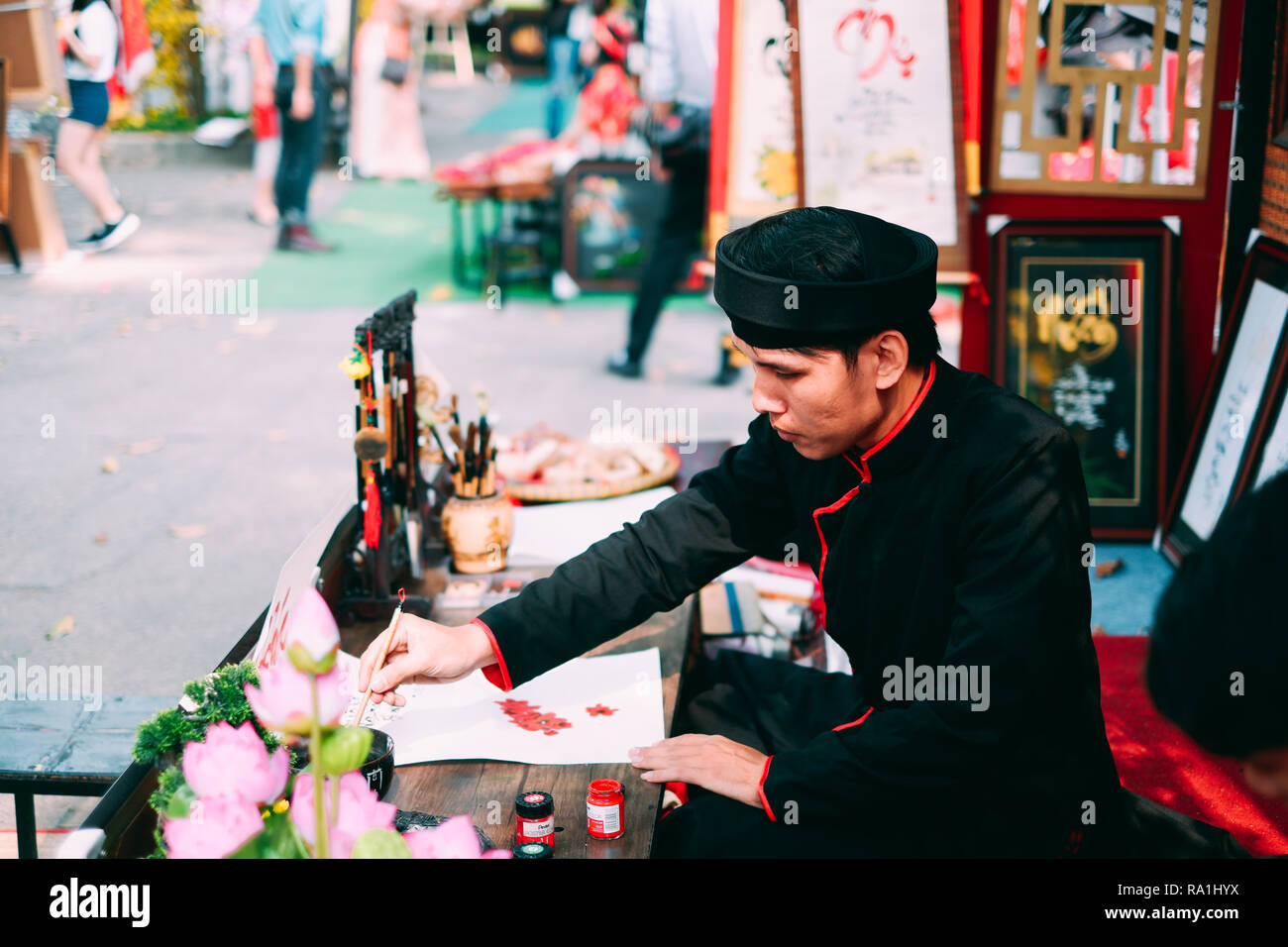 Vietnamese scholar writes calligraphy at lunar new year. Calligraphy ...