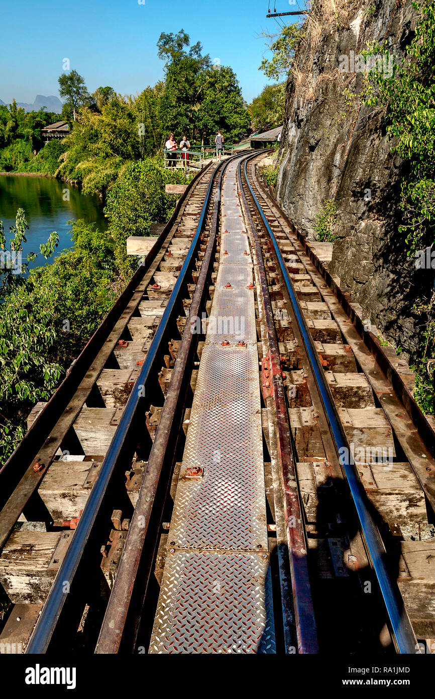 Railroad tracks running next too and above the river Kwai in Thailand ...