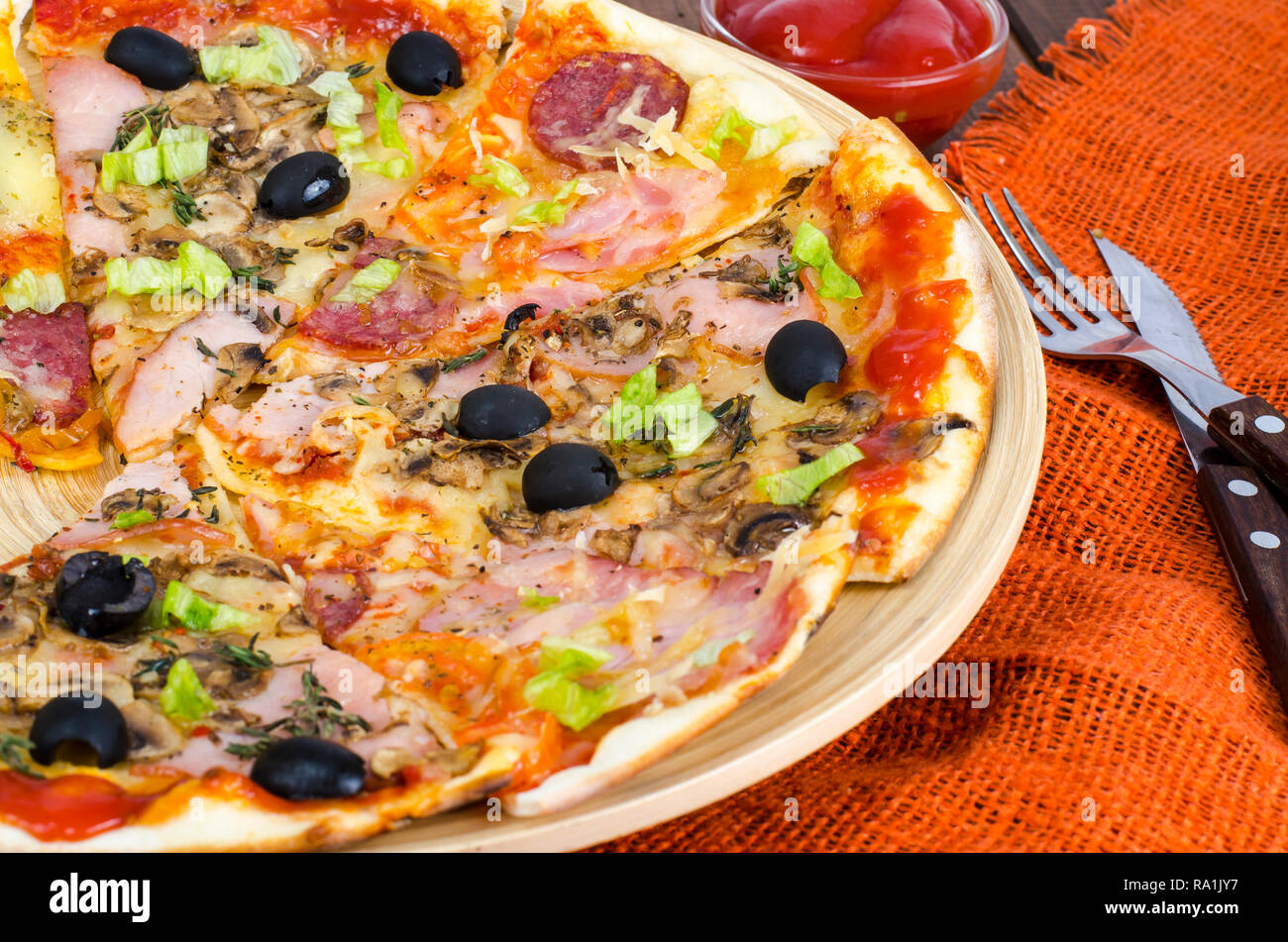 Six slices of pizza with different toppings on wooden board. Studio ...