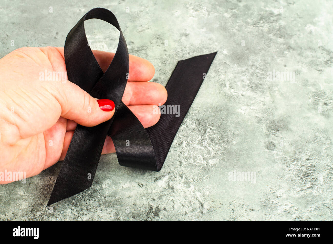 Black ribbon awareness for melanoma and skin cancer. Studio Photo Stock ...