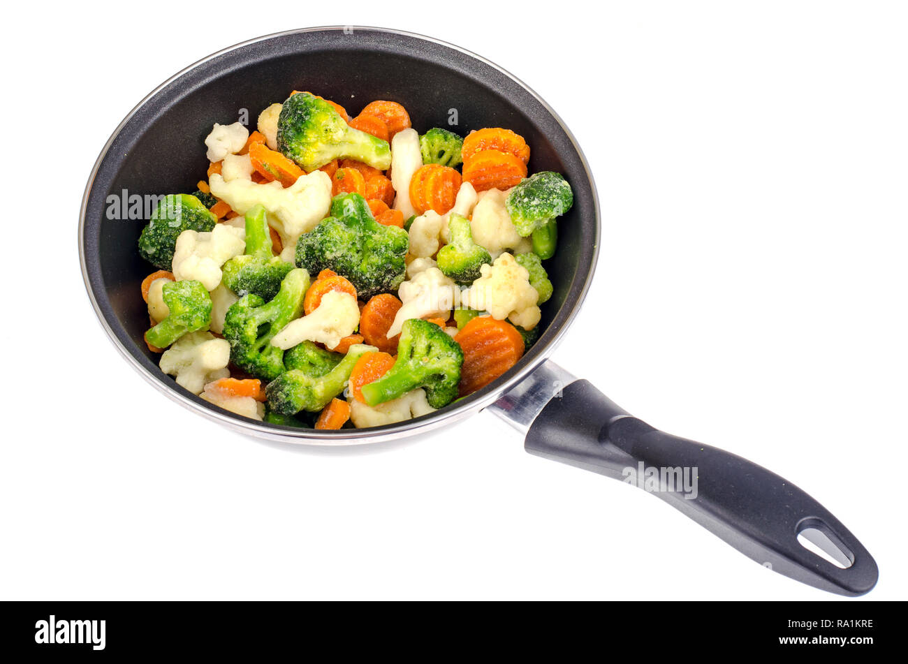 Pan with frozen vegetable mix for frying. Studio Photo Stock Photo - Alamy