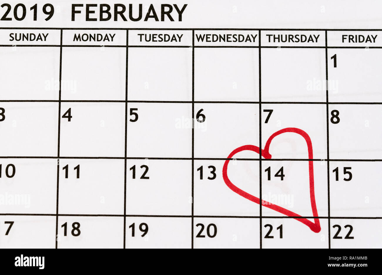 monthly calendar February detail view with a red heart drawn on the ...