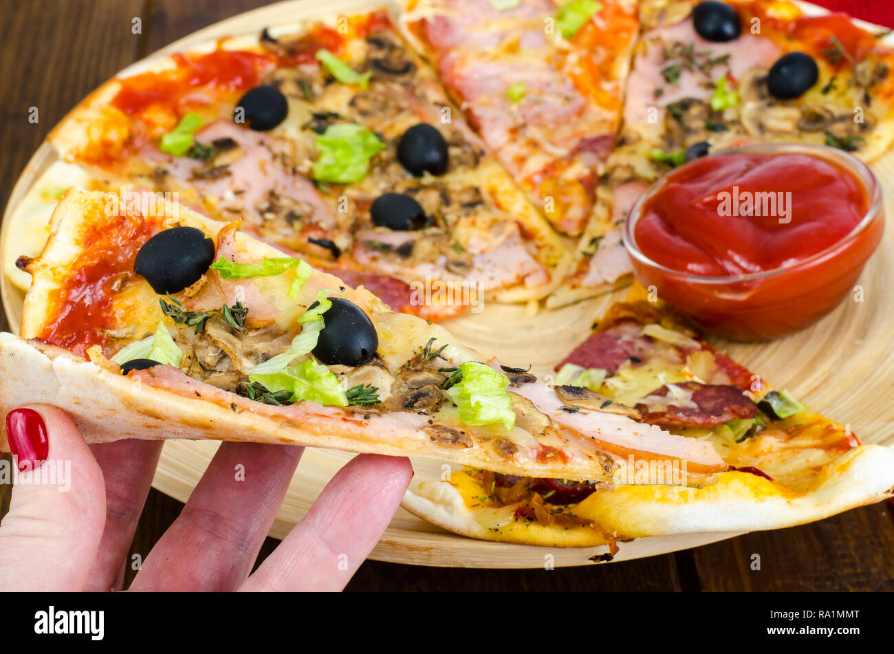 Woman grabbing slice pizza hi-res stock photography and images - Alamy