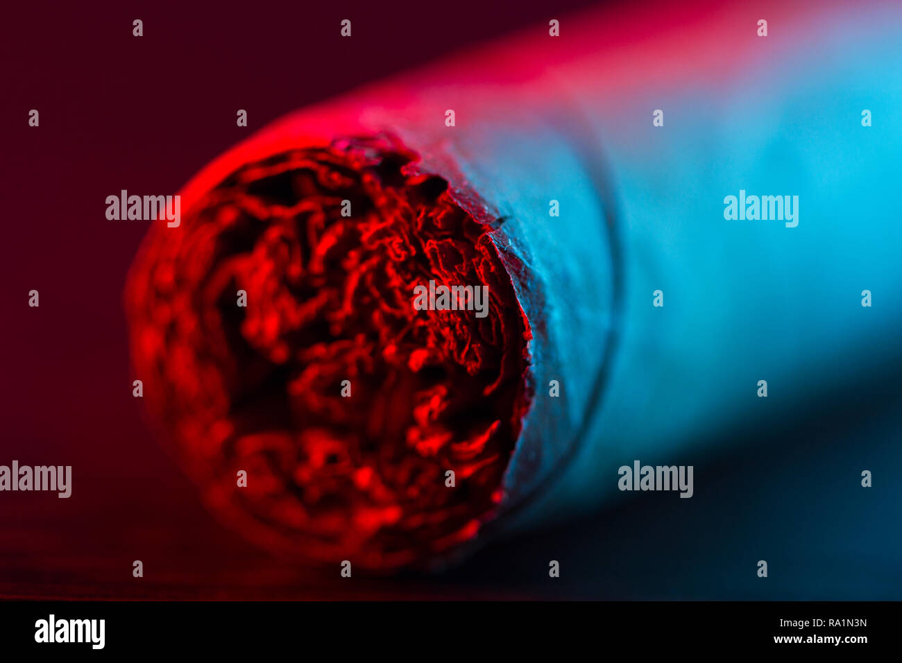 Close up of cigars in neon light Stock Photo - Alamy