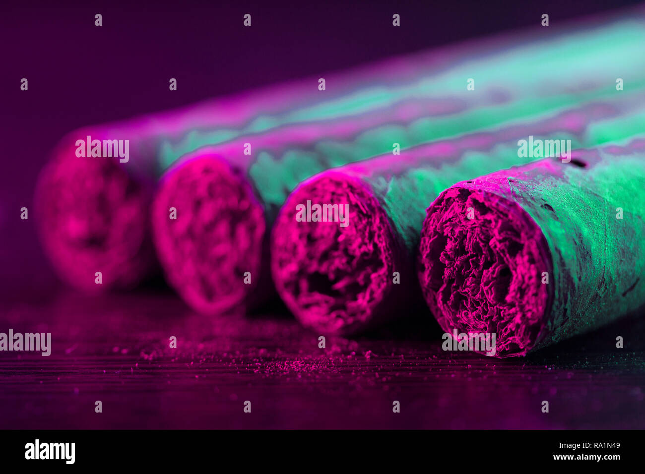 Close up of cigars in neon light Stock Photo - Alamy