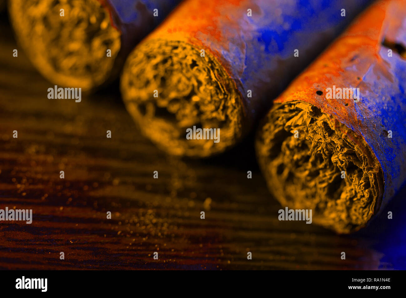 Close up of cigars in neon light Stock Photo - Alamy