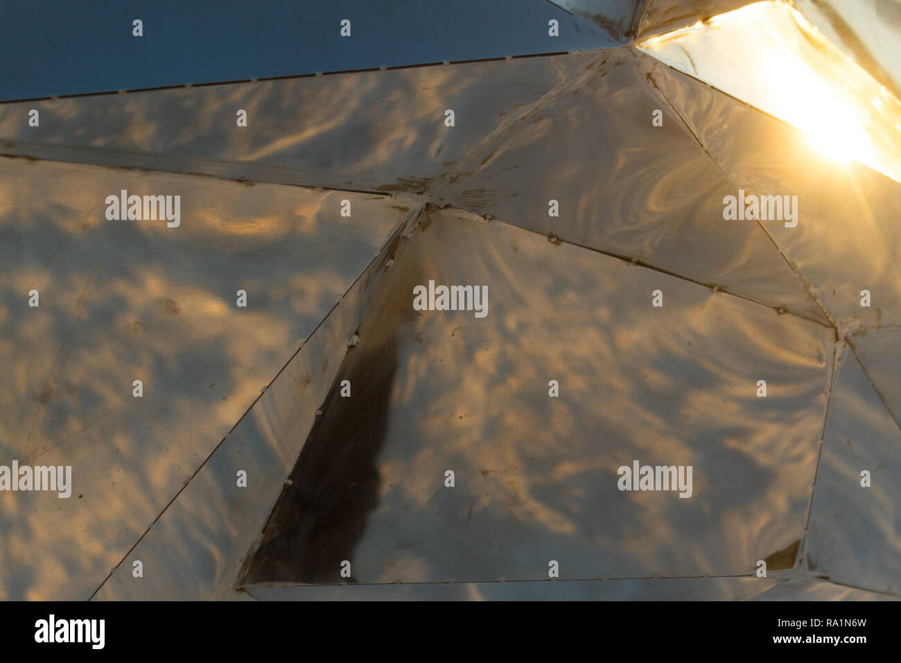 abstract metal background. sun is reflecting on it Stock Photo - Alamy