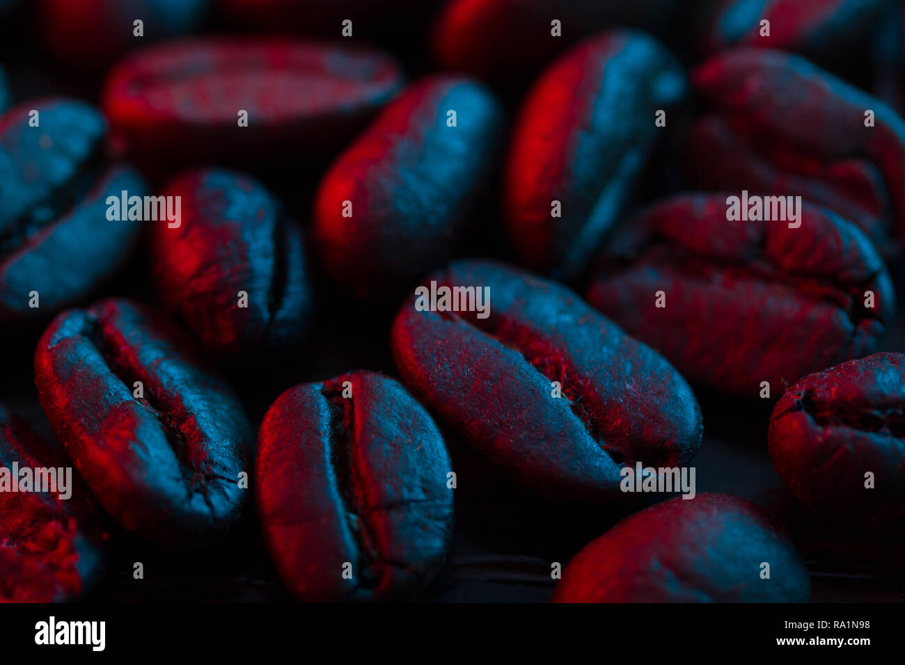 Roasted coffee bean close up in neon light Stock Photo - Alamy