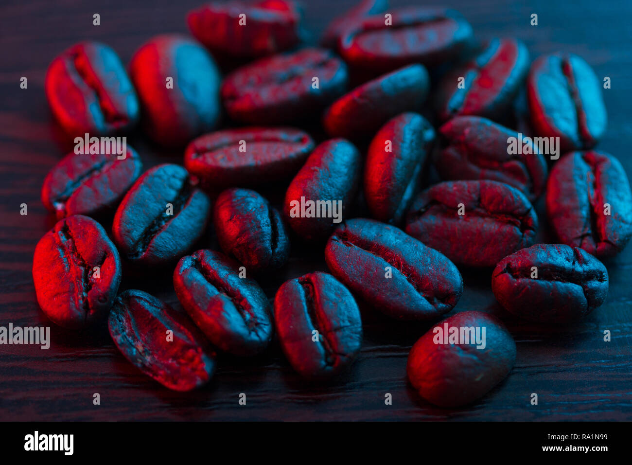 Roasted coffee bean close up in neon light Stock Photo - Alamy