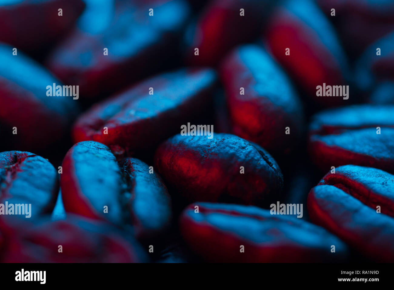 Roasted coffee bean close up in neon light Stock Photo - Alamy